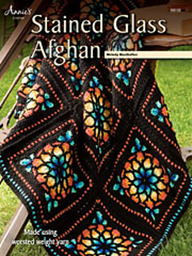 It's finally getting cold enough to use the stained glass window afghan ...